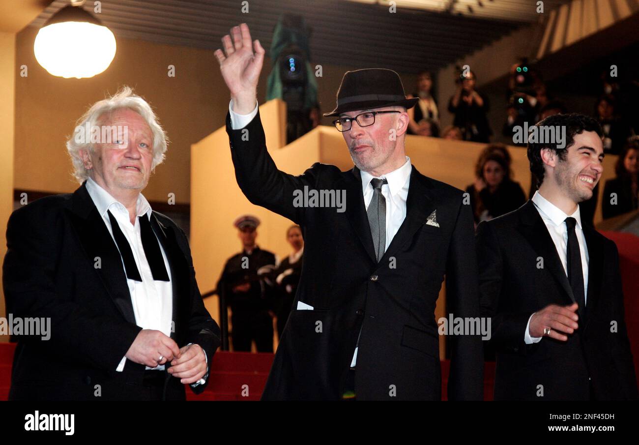 French director Jacques Audiard, center, waves as he leaves after the ...