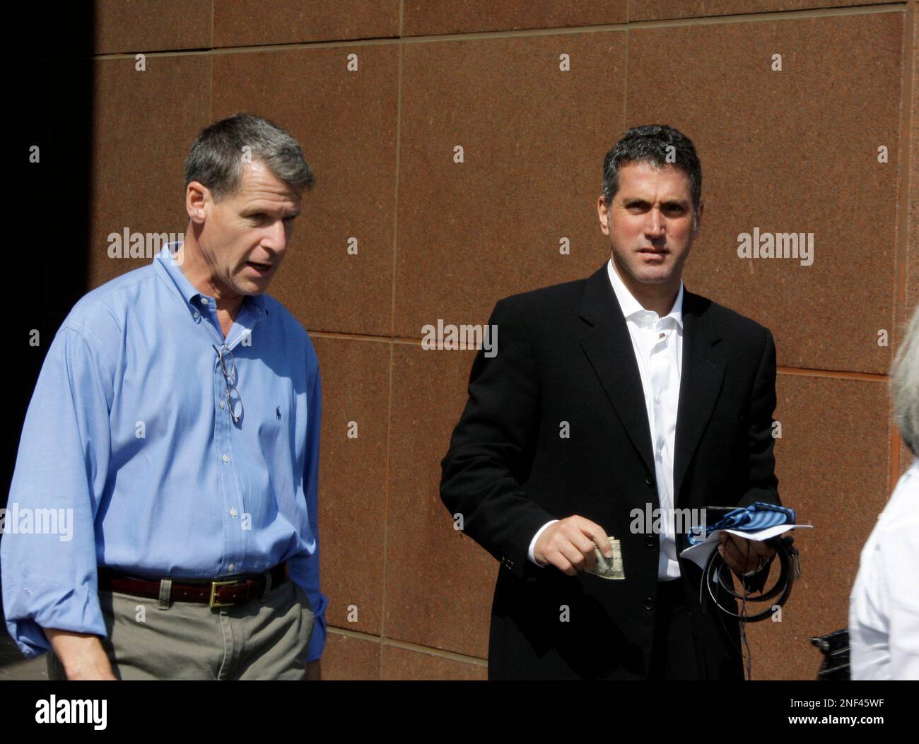Beverly Hills hedge fund manager Bradley L. Ruderman, right, holds his ...