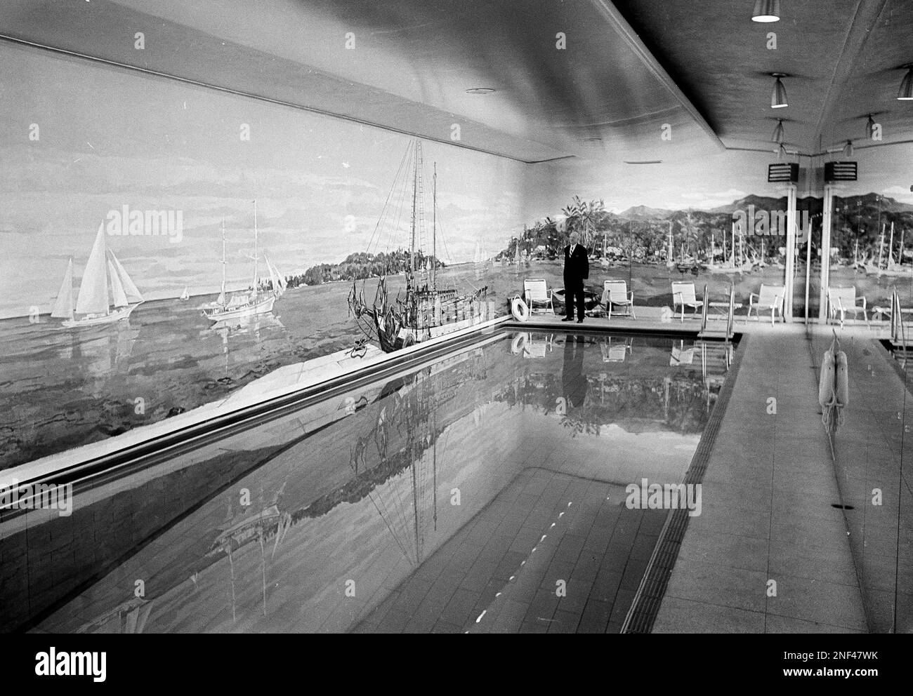 Homer Gruenther is shown alongside the White House swimming pool, April ...