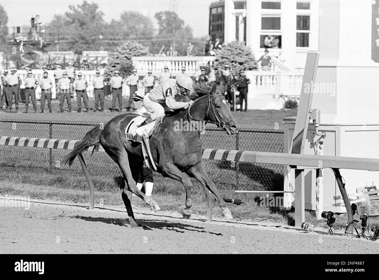Ferdinand, with jockey Bill Shoemaker in the irons, crosses the finish ...