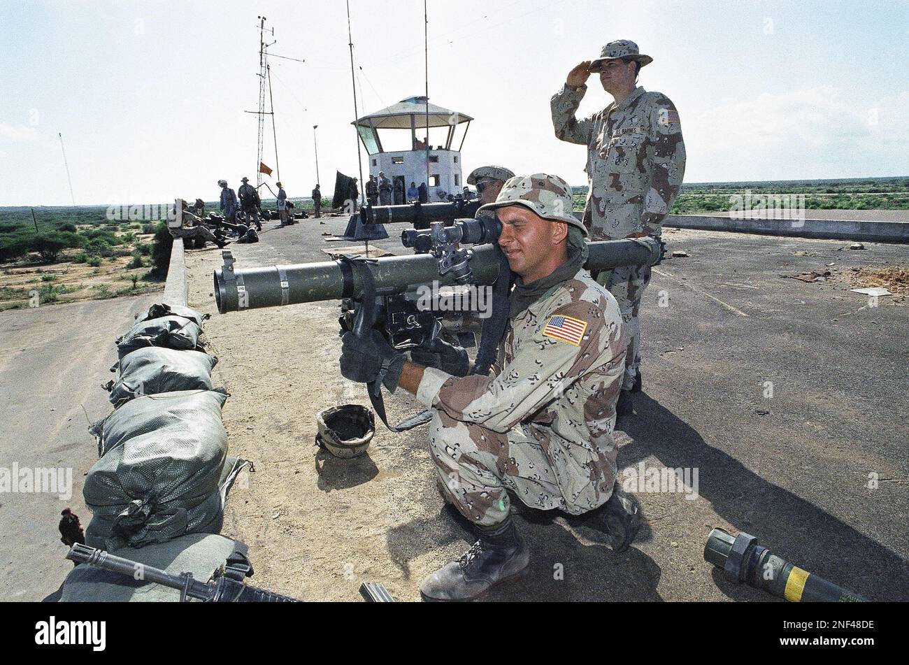Marine Cpl. Aaron White sights in on an approaching Somali vehicle from ...