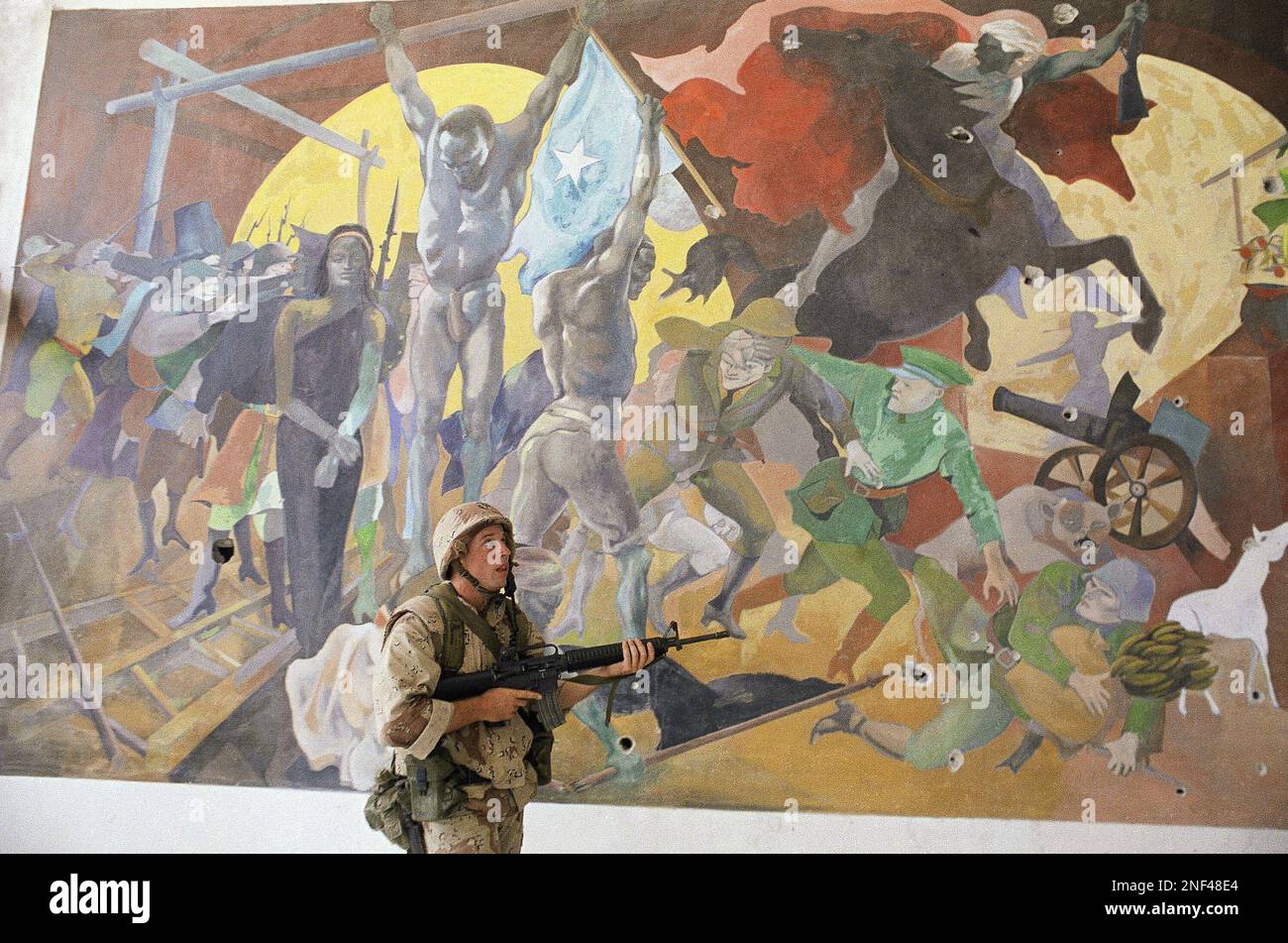 An unidentified U.S. Marine enters the bullet riddled Somali Parliament ...