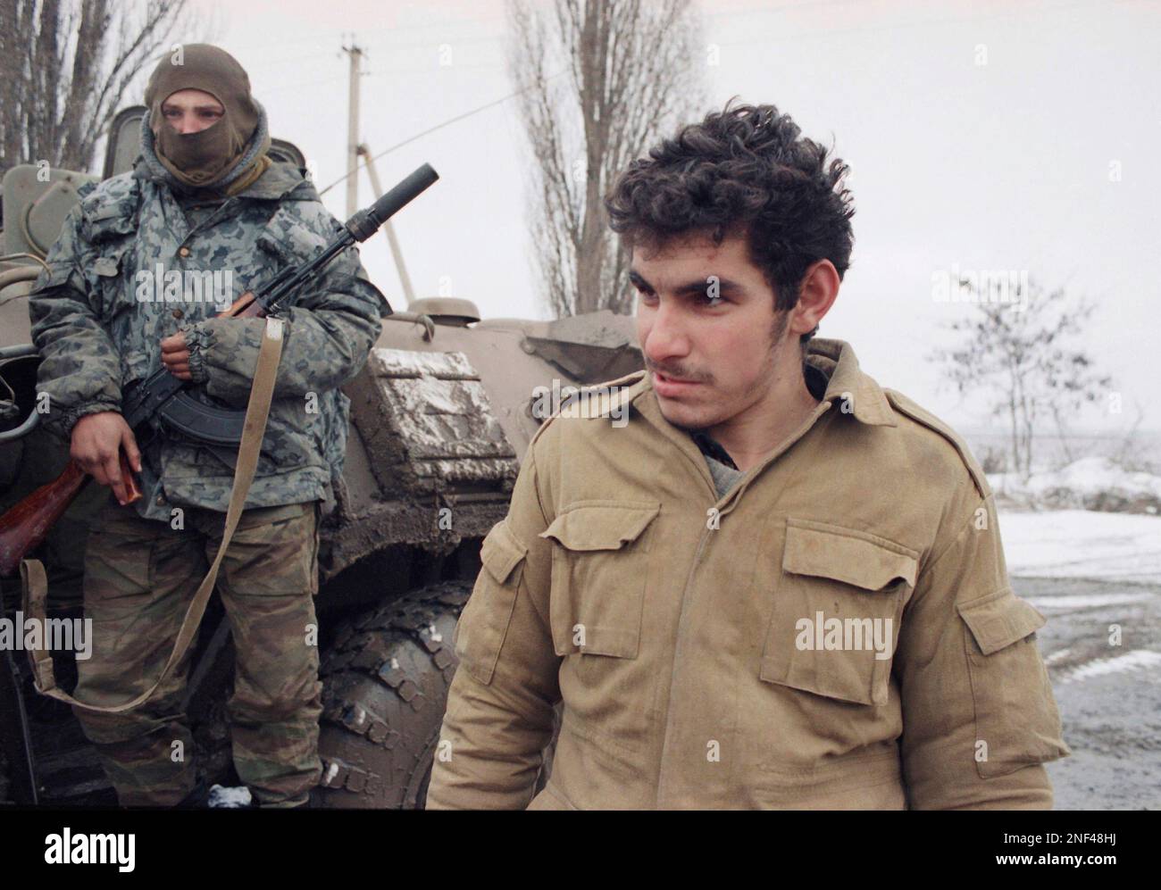 Musa Belikmayev, a young Chechen fighter, is handed over to his family ...