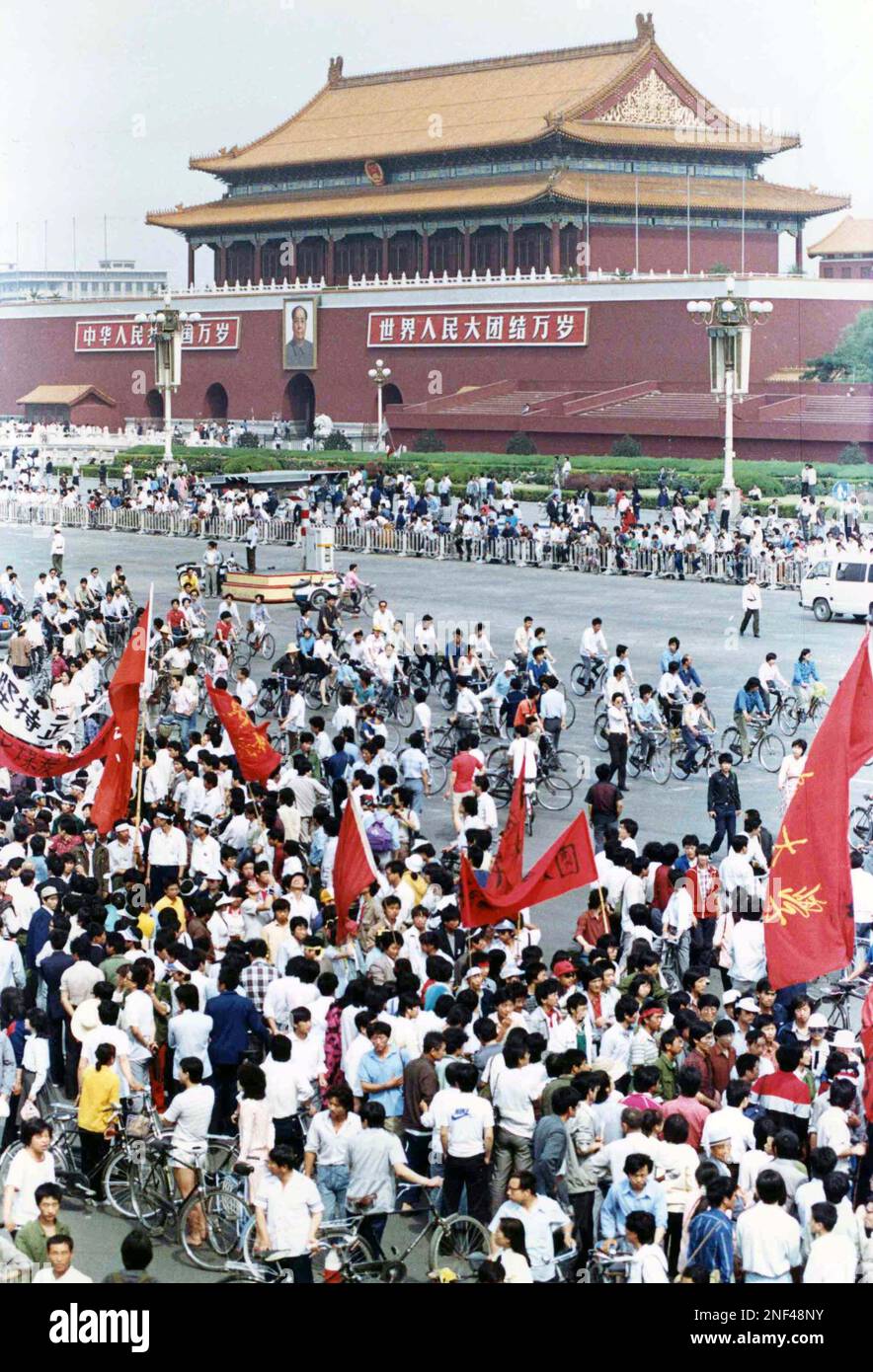 Tens of thousands of students march from Tiananmen Square during a ...