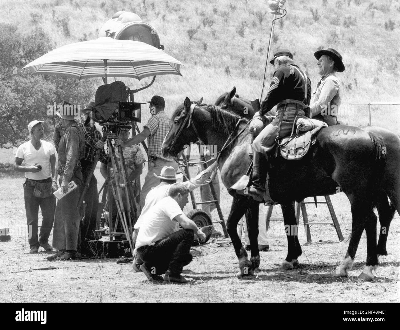 Holding their horses, guest star James Whitmore, right, and featured ...