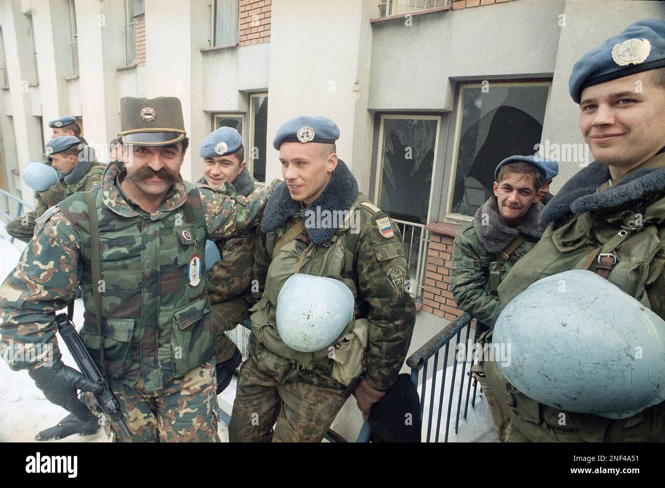 A Serb soldier and a Russian U.N. peacekeeper, right, pose for ...