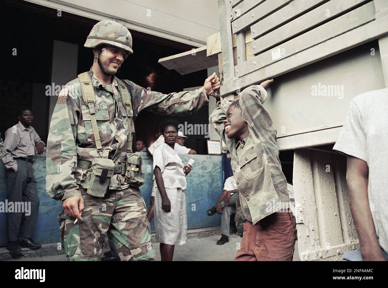 Specialist James Spenceley, 26, of Charlevoix, Mich., talks to Junior ...