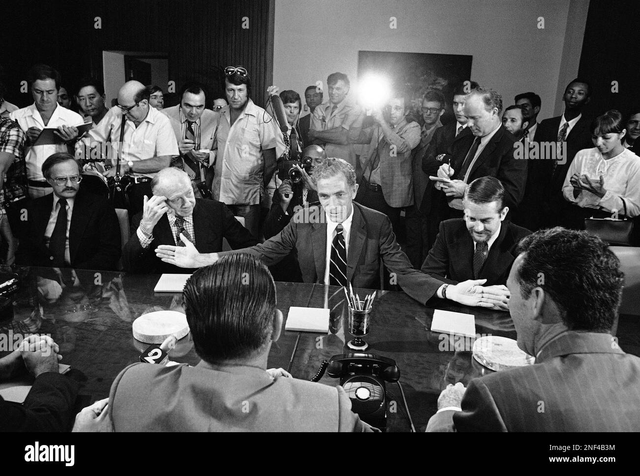 Senator Claiborne Pell, D-R.I., opens his arms as he speaks with Cuban ...