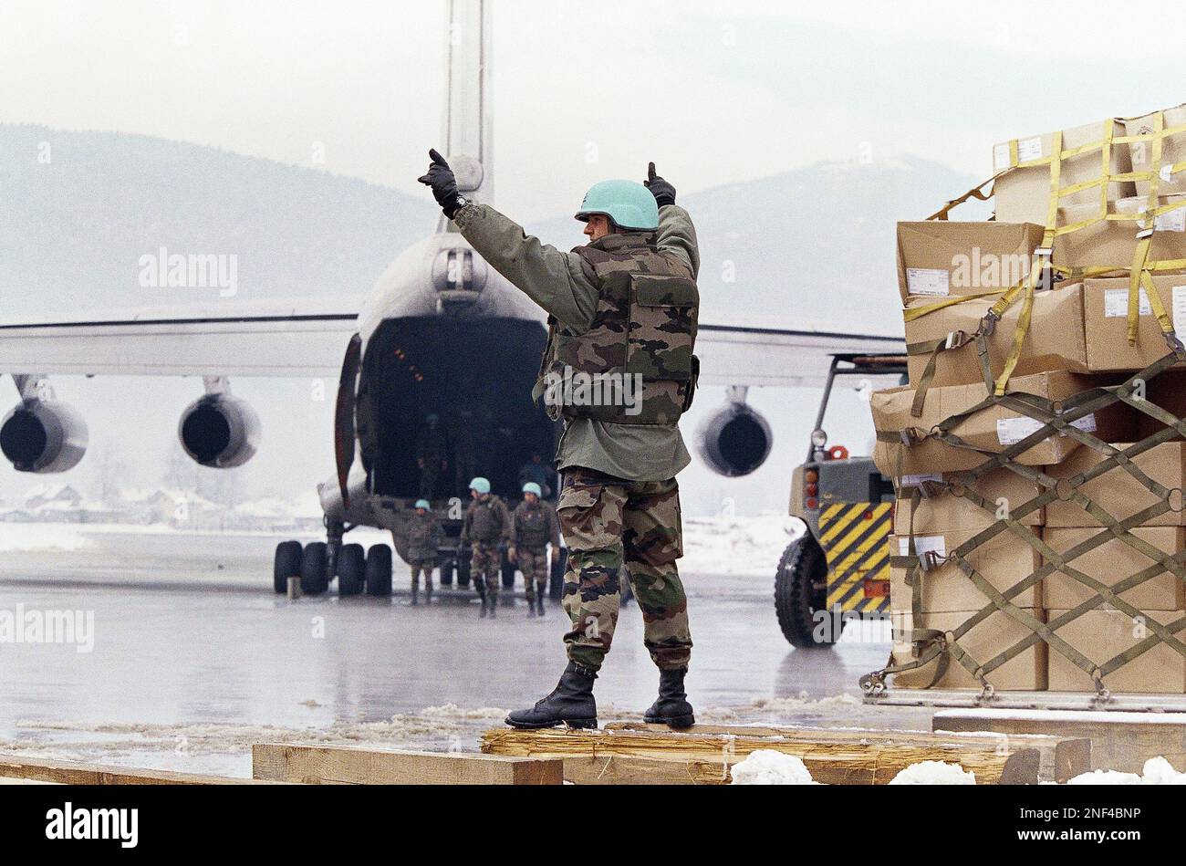 A French United Nations peacekeeper at Sarajevo Airport directs a fork ...