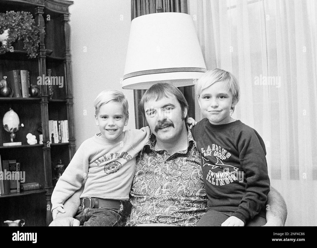 Dick Butkus is shown with two of his three children, Nikki, age 6 (a ...