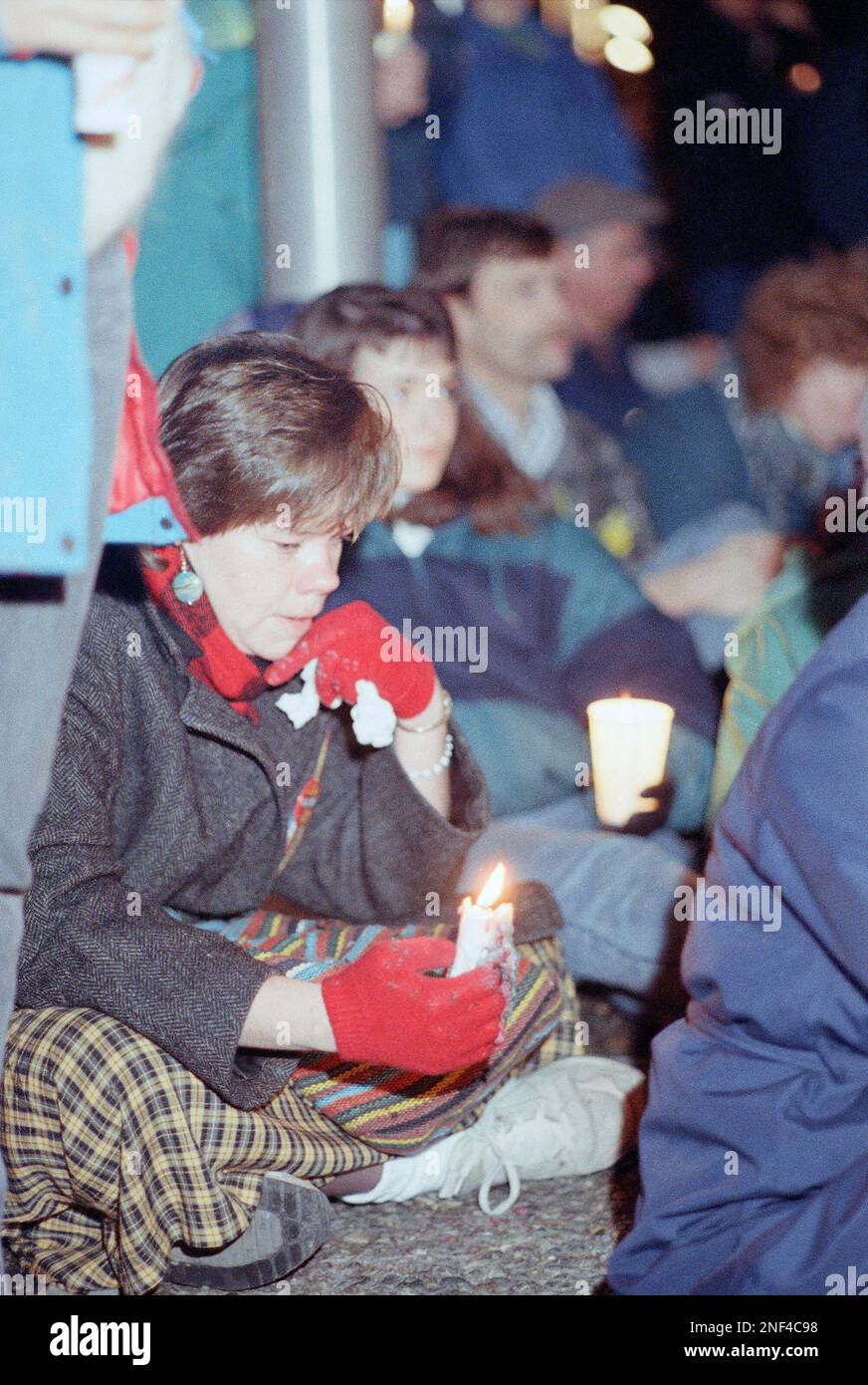 Anne Helene Cagney of Seattle struggles to hold back her grief when ...