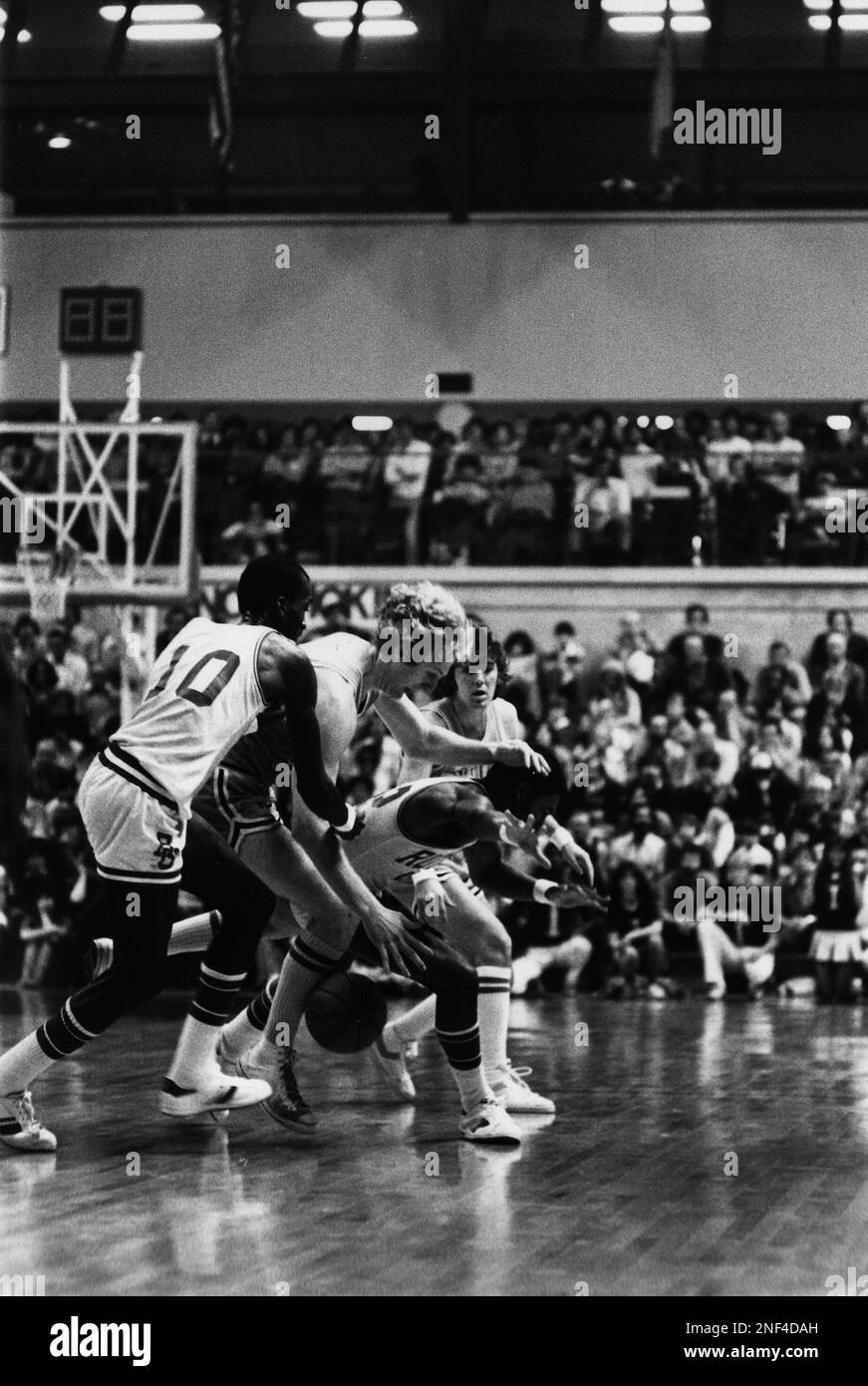 Larry Bird of Indiana State kicks the ball out of bounds with moments ...