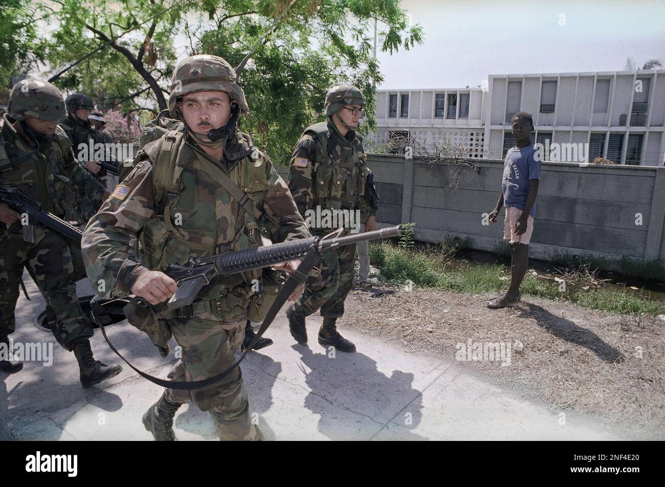 U.S. soldiers on foot patrol walk through the streets of Port-au-Prince ...