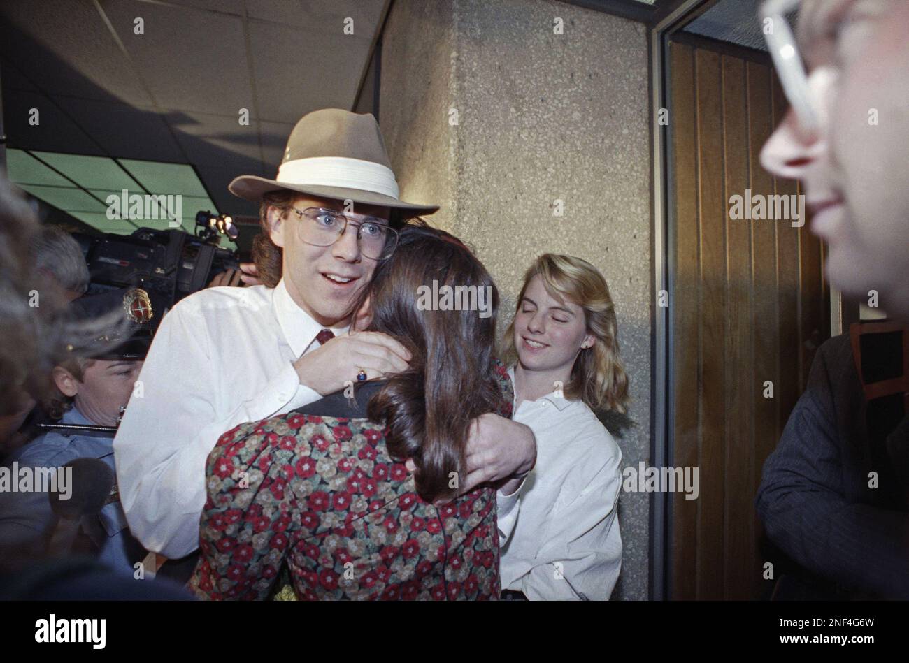 Peter Timko of Lancaster, Pa. center, is greeted by an unidentified ...