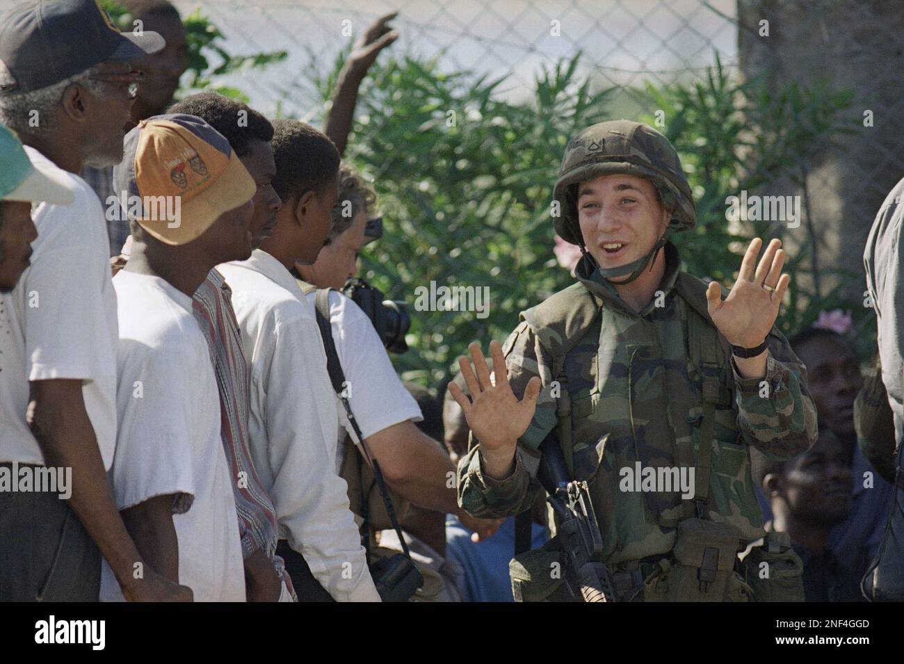U.S. Army Pft. Matthew Lovelace laughs with Haitians as patrols the ...