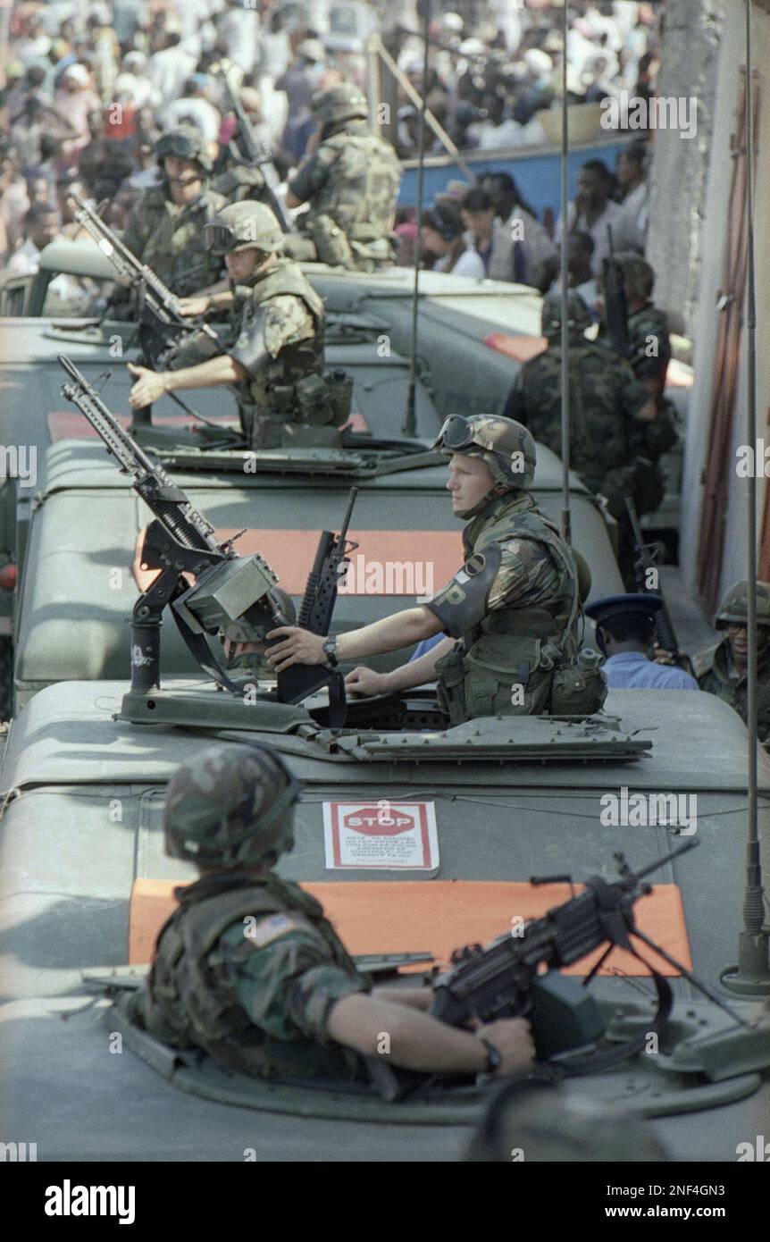 U.S. Army military police form a blockade with their HUMVEEs around a ...