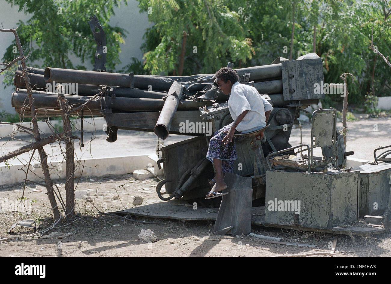 A Somali child climbs up on the remains of a multiple rocket-launcher ...
