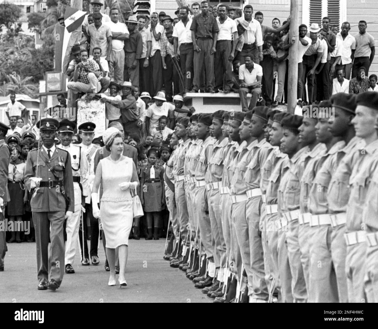 Britain's Queen Elizabeth II is escorted by the Guard Commander as she ...