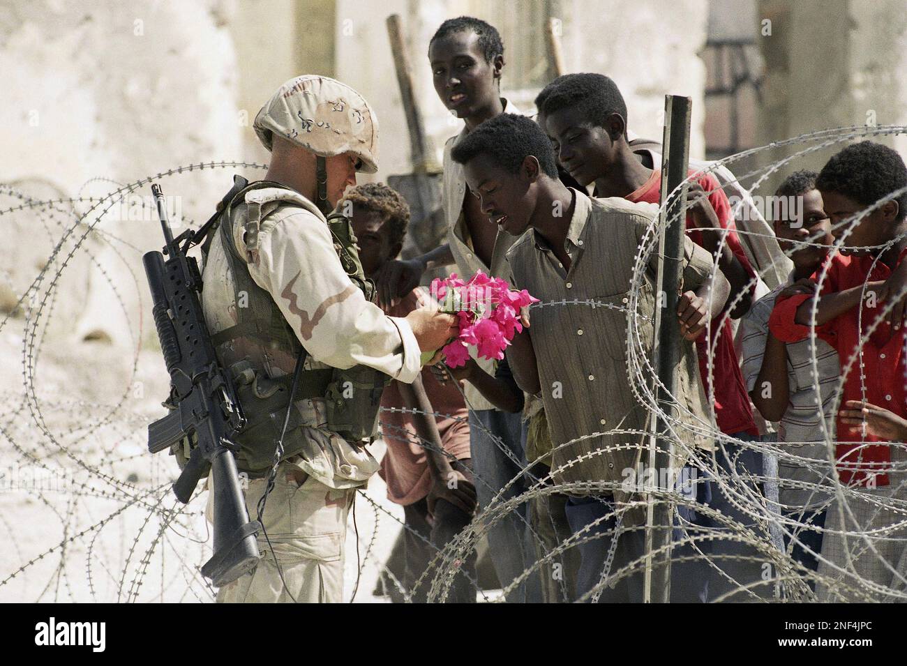 U.S. Marine PFC Bobby Walker of Jamestown, Ca., holds flowers given to ...