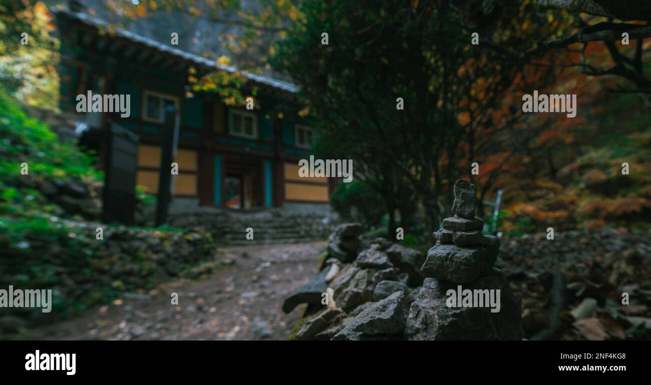 An entrance to a temple complex with stacked stones on Juwangsan during ...