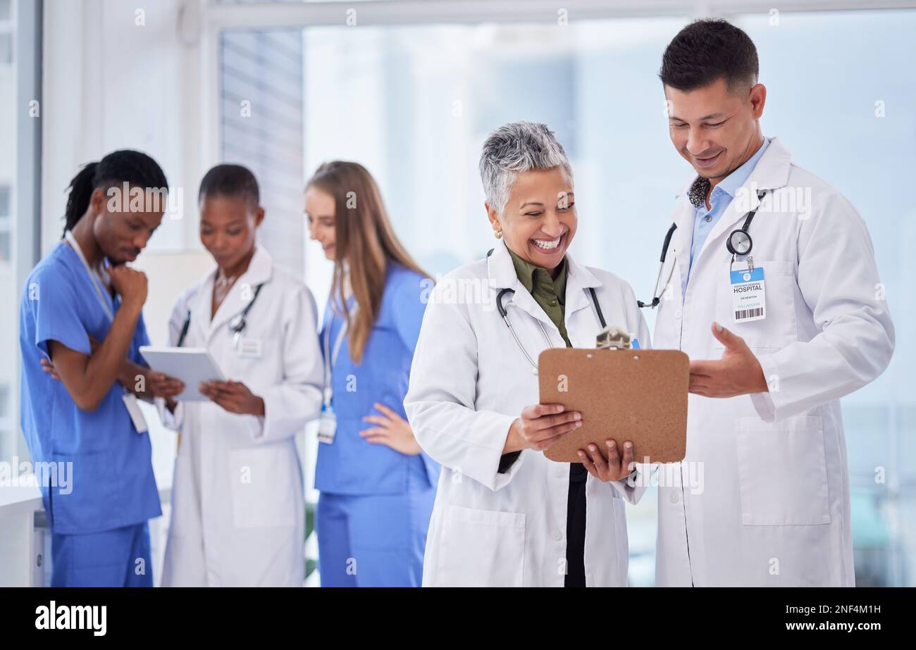 Doctors team, man and woman with checklist, smile and happy for results ...