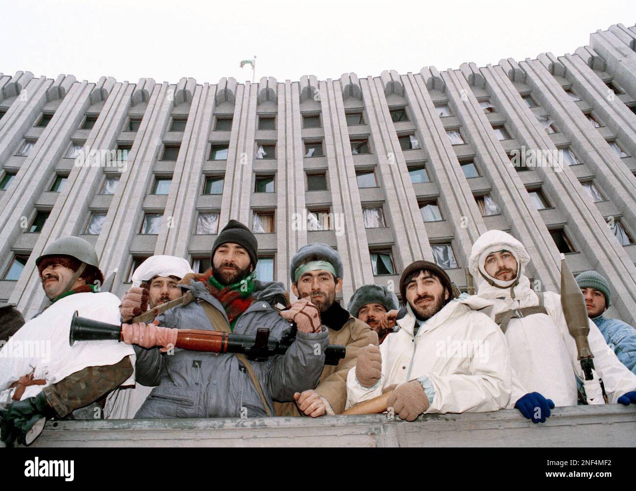 Chechen volunteer fighters rally outside the Presidential Palace before ...