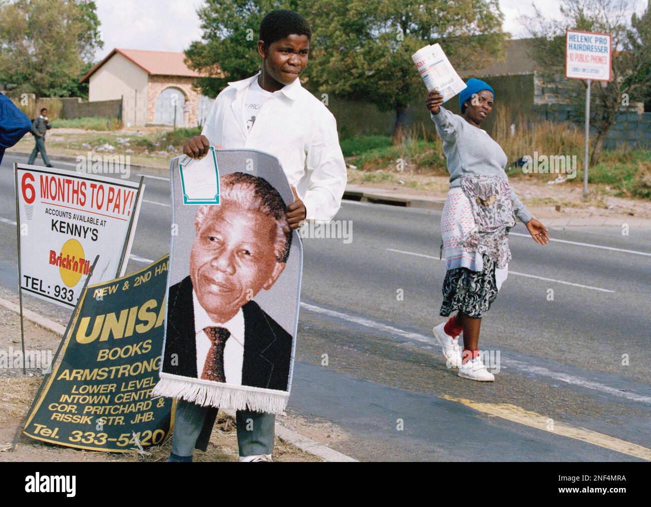 Tabiso Phahlane, 15, hawks carpets bearing the portrait of ANC ...