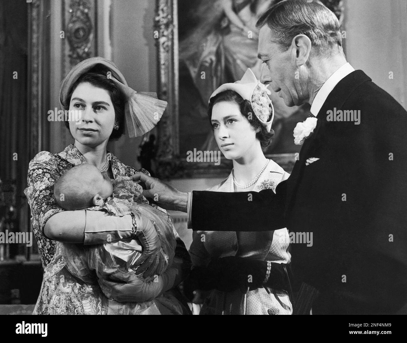 King George VI tugs at the chin of his granddaughter, Princess Anne ...