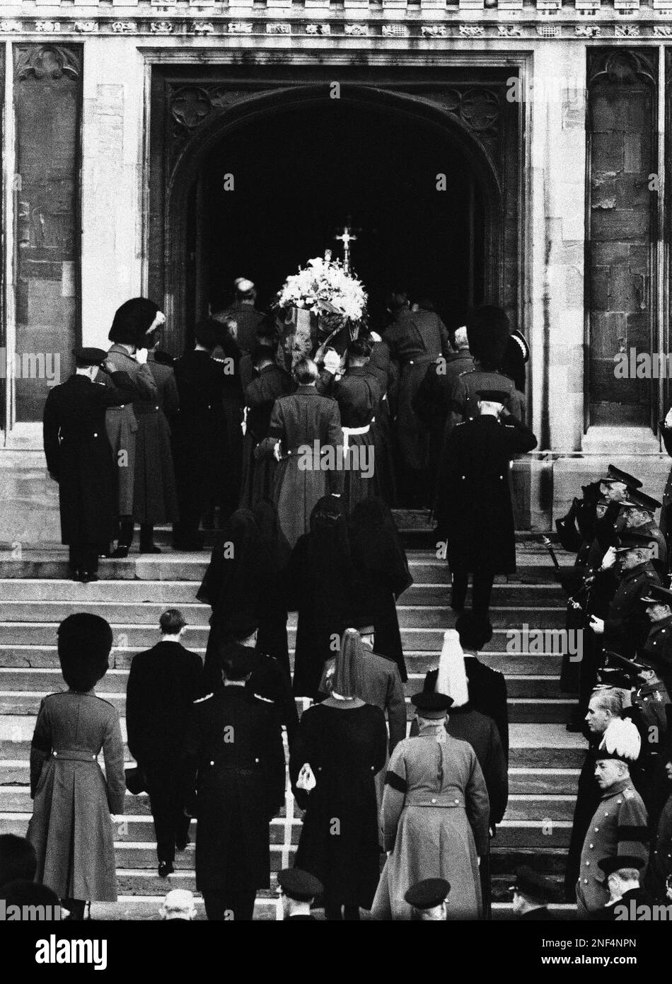The draped coffin of King George VI is carried into St. George's Chapel ...