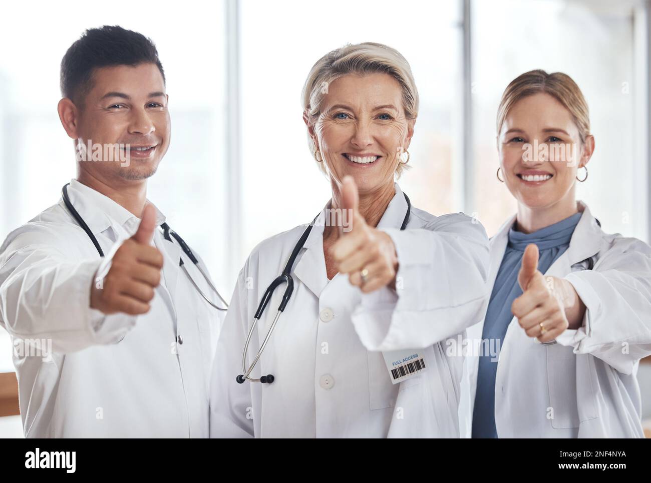 Doctor, team and portrait smile with thumbs up for healthcare success ...