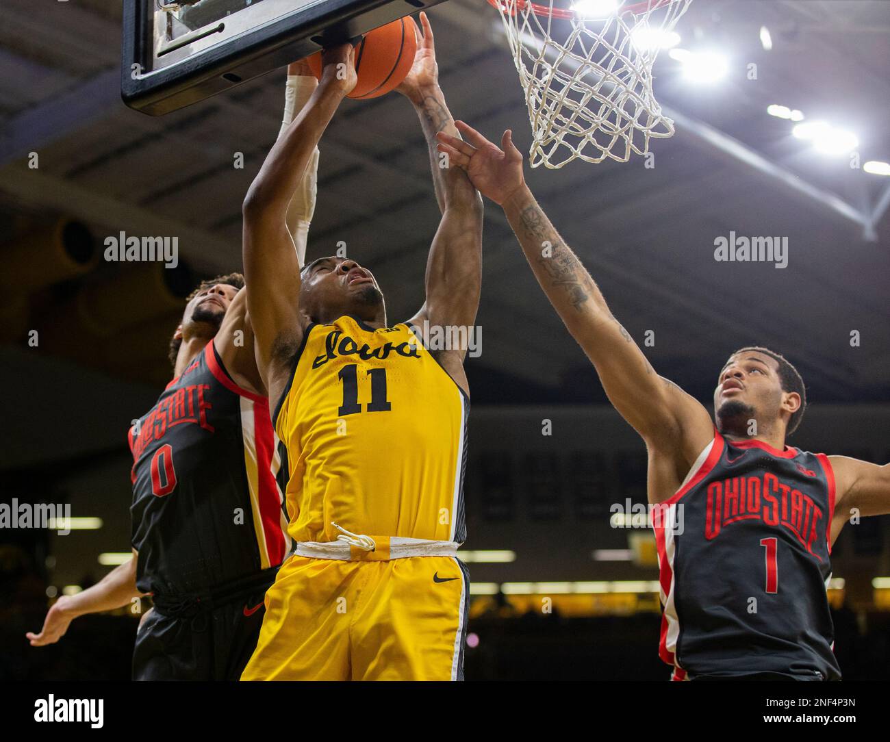 Ohio State guard Tanner Holden (0) tries to knock the ball away from ...