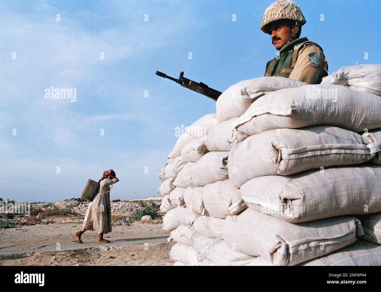 A Pakistani soldier stands guard at a United Nations military ...