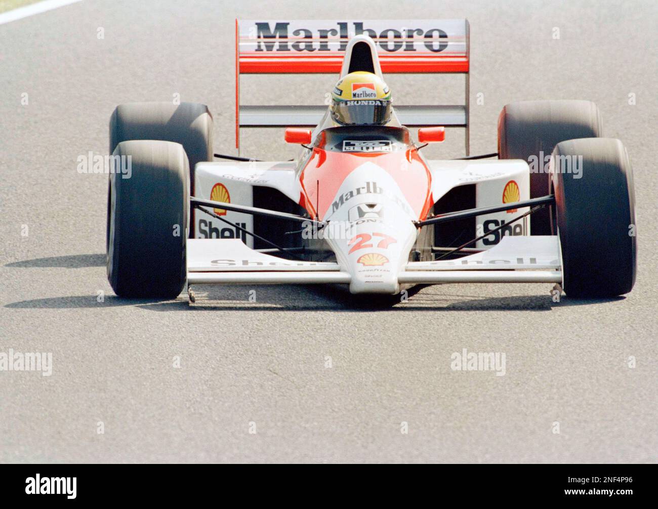 Ayrton Senna of Brazil drives a McLaren-Honda during qualifying ...