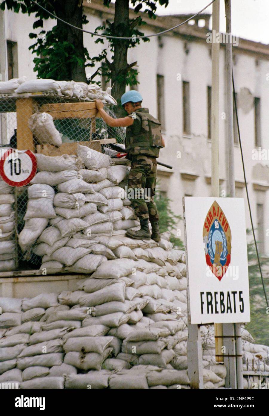 A French United Nations peacekeeper reinforces a defensive position at ...
