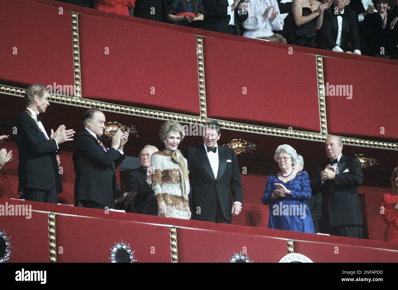 President Ronald Reagan and first lady Nancy Reagan are applauded as ...