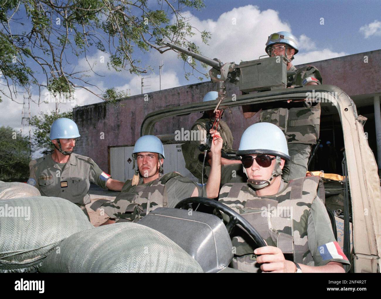 French Marine Corps keep watch outside a radio station controlled by ...