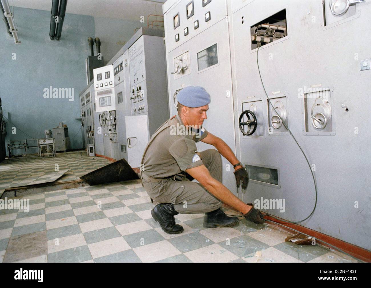 Col. Peter DeSaqui of the 5th French Marine Corps puts plastic ...