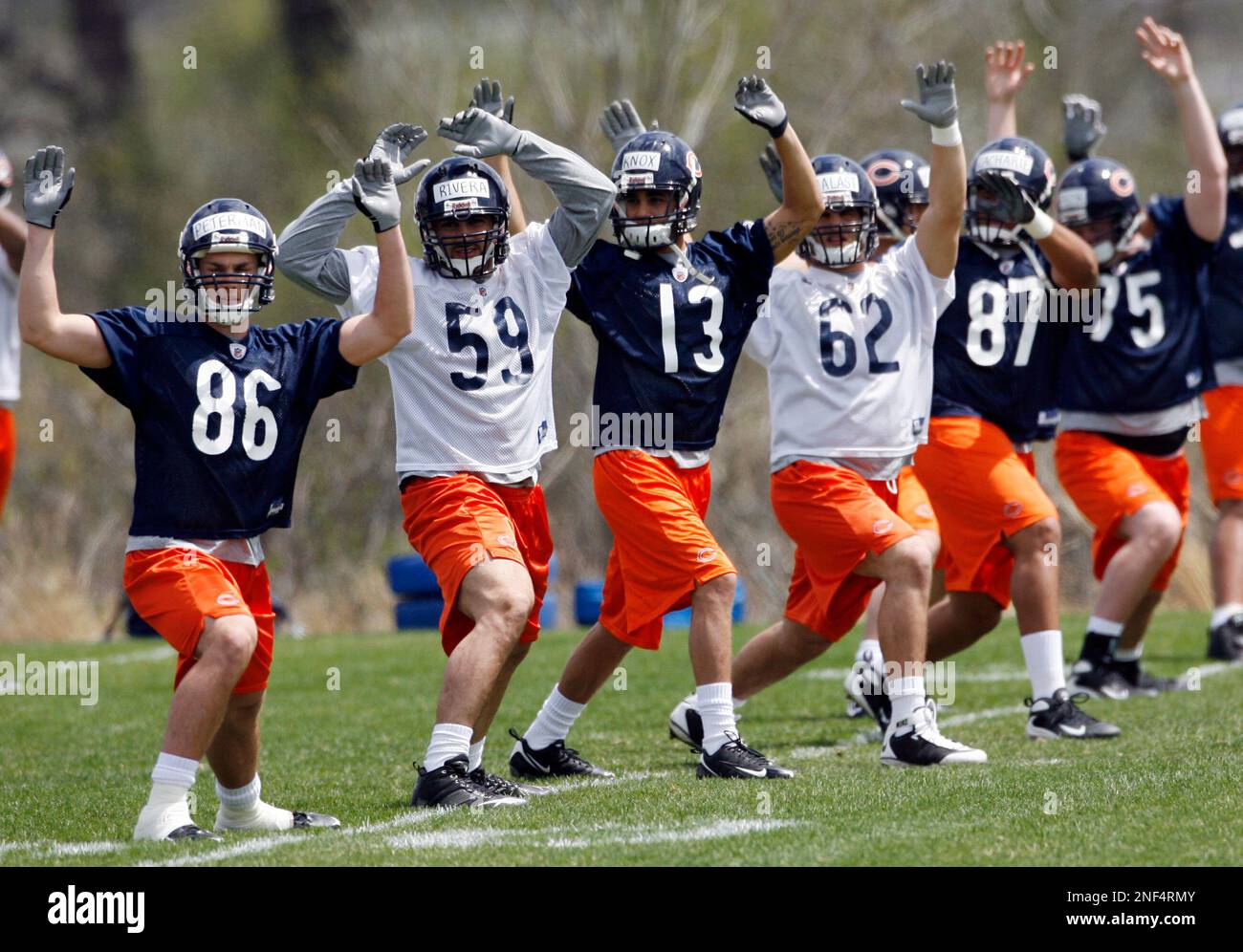 Chicago Bears' Eric Peterman (86), Mike Rivera(59), Johnny Knox(13 ...