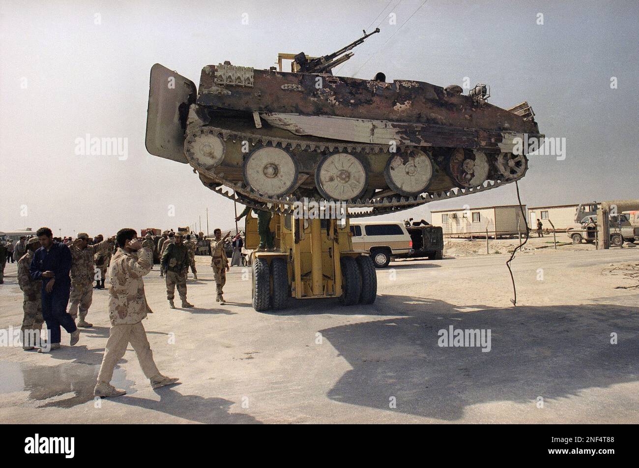 Saudi troops use a forklift truck on Thursday, Feb. 7, 1991 in Saudi ...