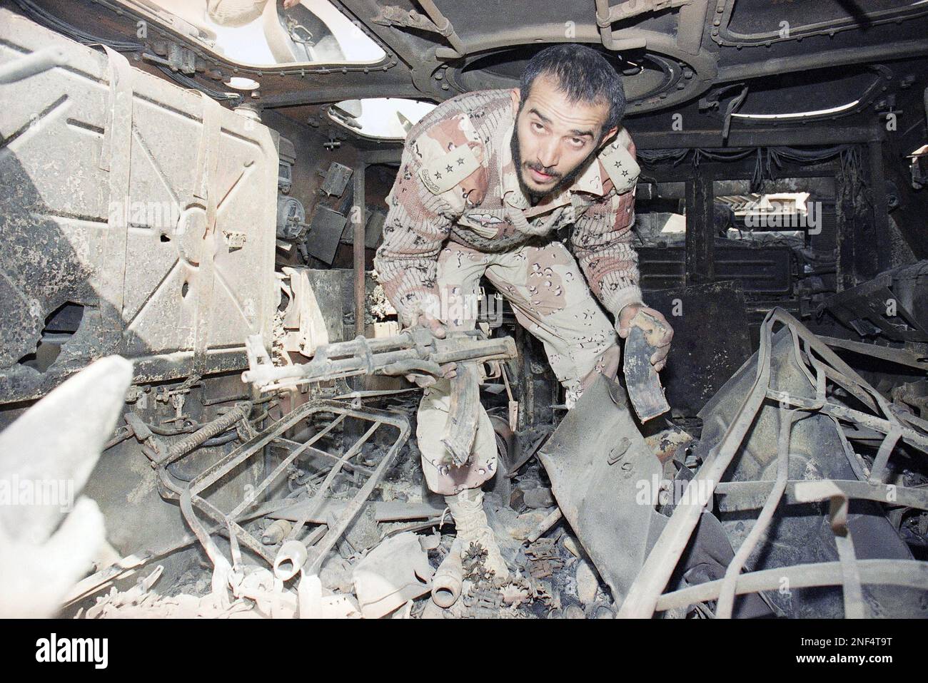A Saudi soldier emerges on Thursday, Feb. 8, 1991 in Saudi Arabia ...