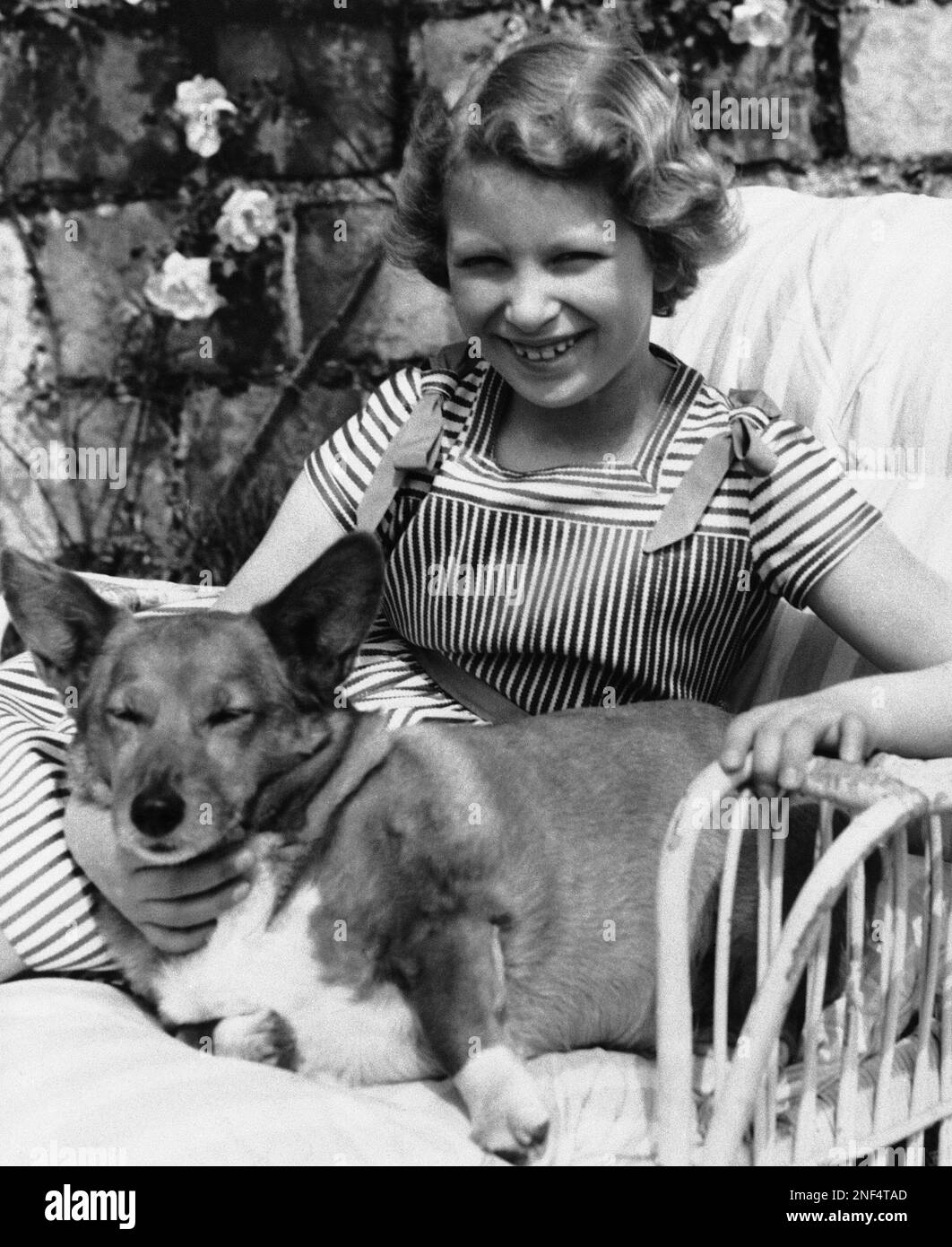 England's Princess Anne, 9, daughter of Queen Elizabeth II, holds one ...