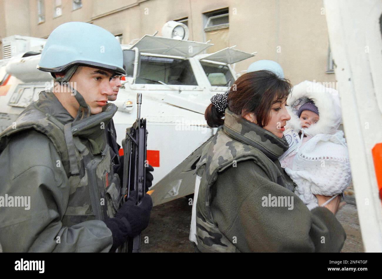 Eight month-old Salima Talovic is carried by U.N. medical evacuation ...