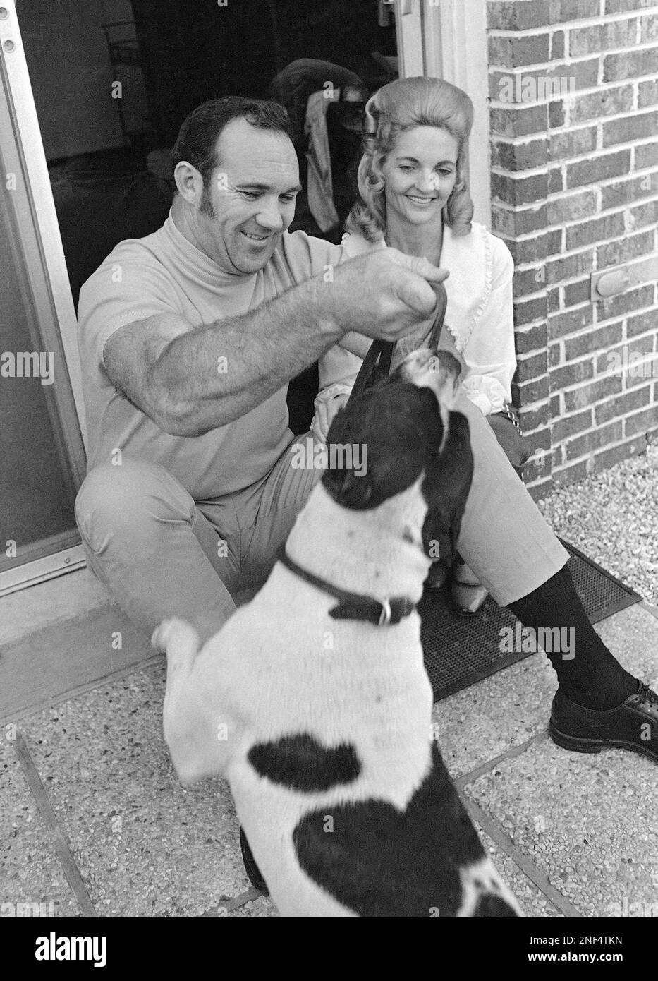 New Orleans Saints big defensive end Doug Atkins plays with his bulldog ...