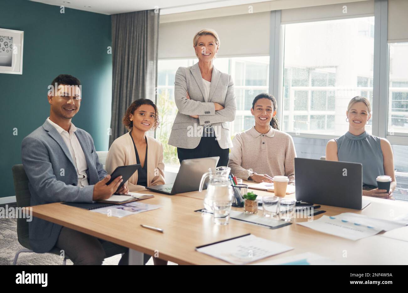 Portrait of employees at desk in office with smile, confidence and ...