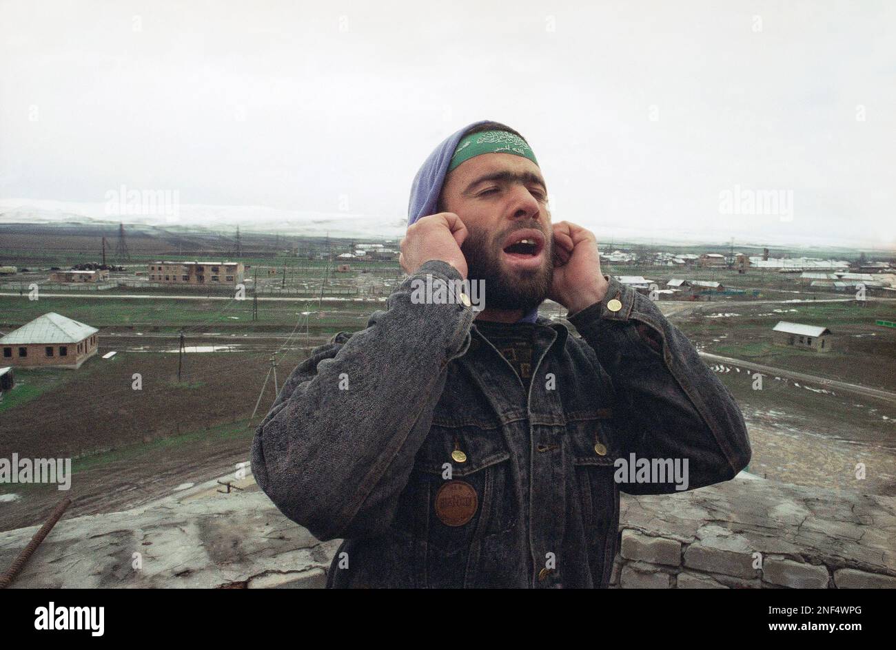 A Chechen rebel fighter makes a prayer cry in the village of Samashky ...