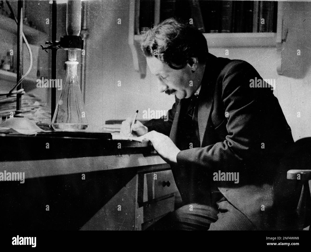 Dr. Ernst Chain is shown in his Oxford lab, Oct. 27, 1944. He is trying ...