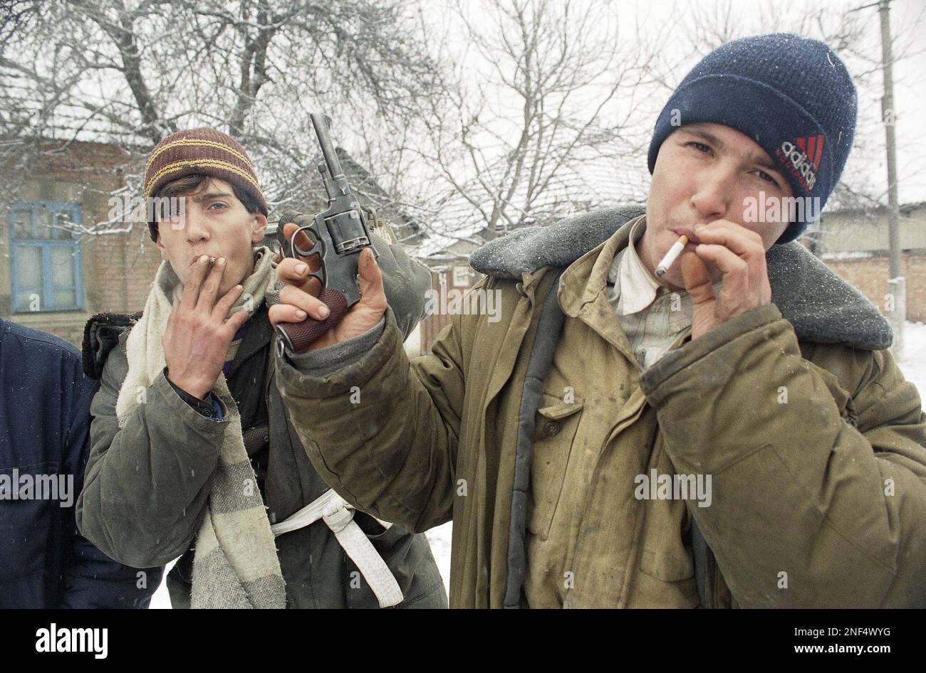 A teenage Chechen rebel shows off his only weapon, a World War I pistol ...