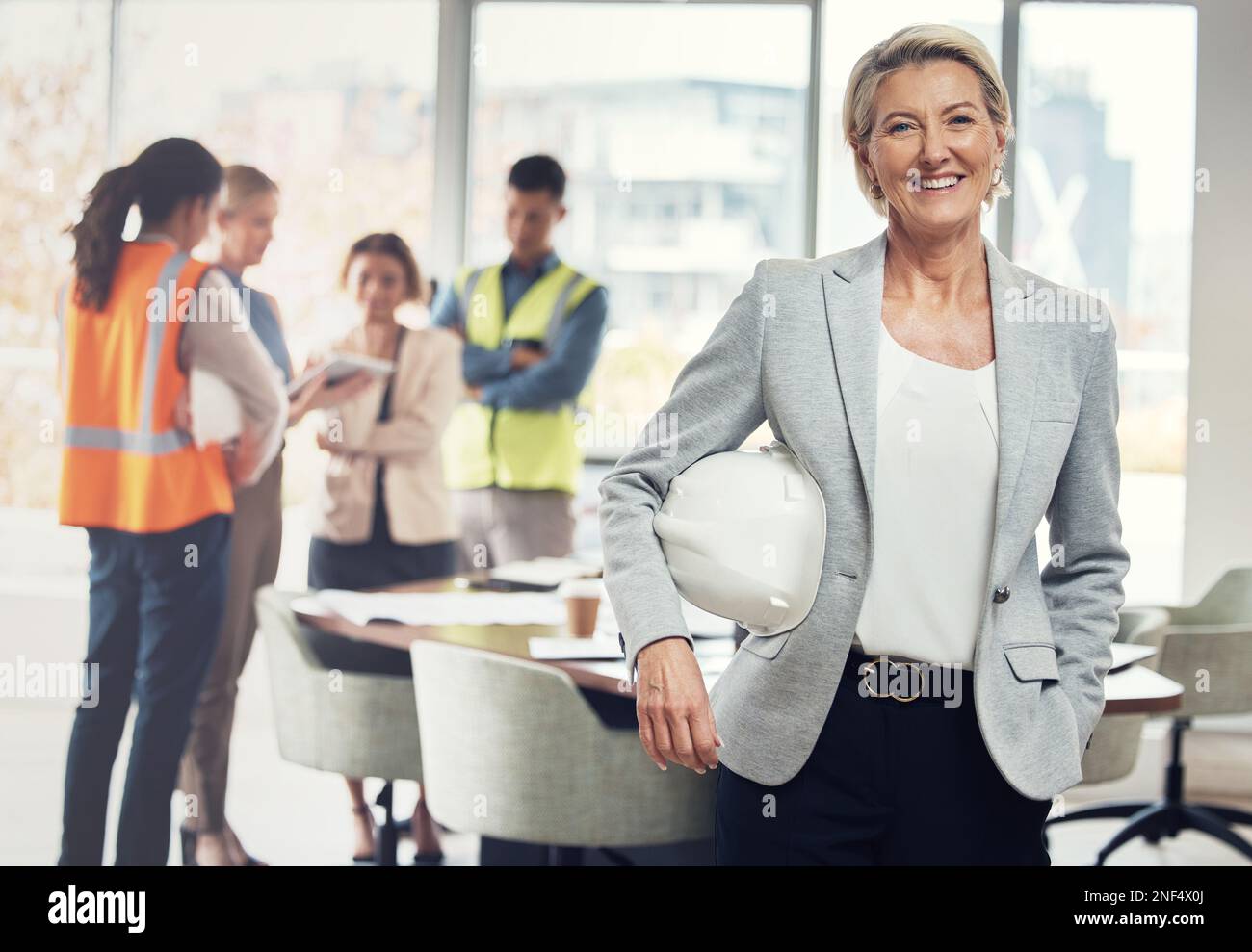Portrait, construction worker and manager with an engineer woman at ...