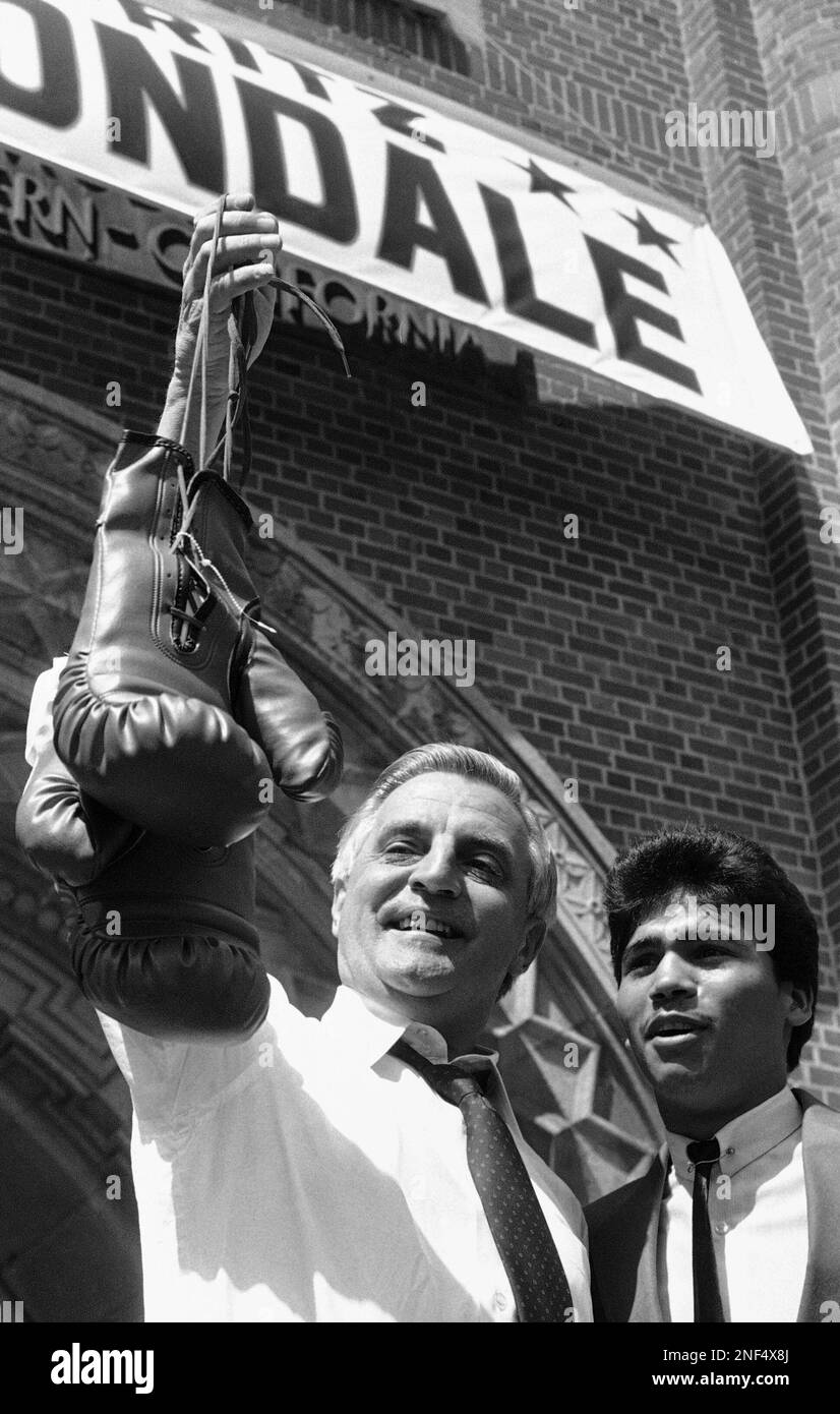 Democratic presidential candidate Walter Mondale holds up a pair of ...