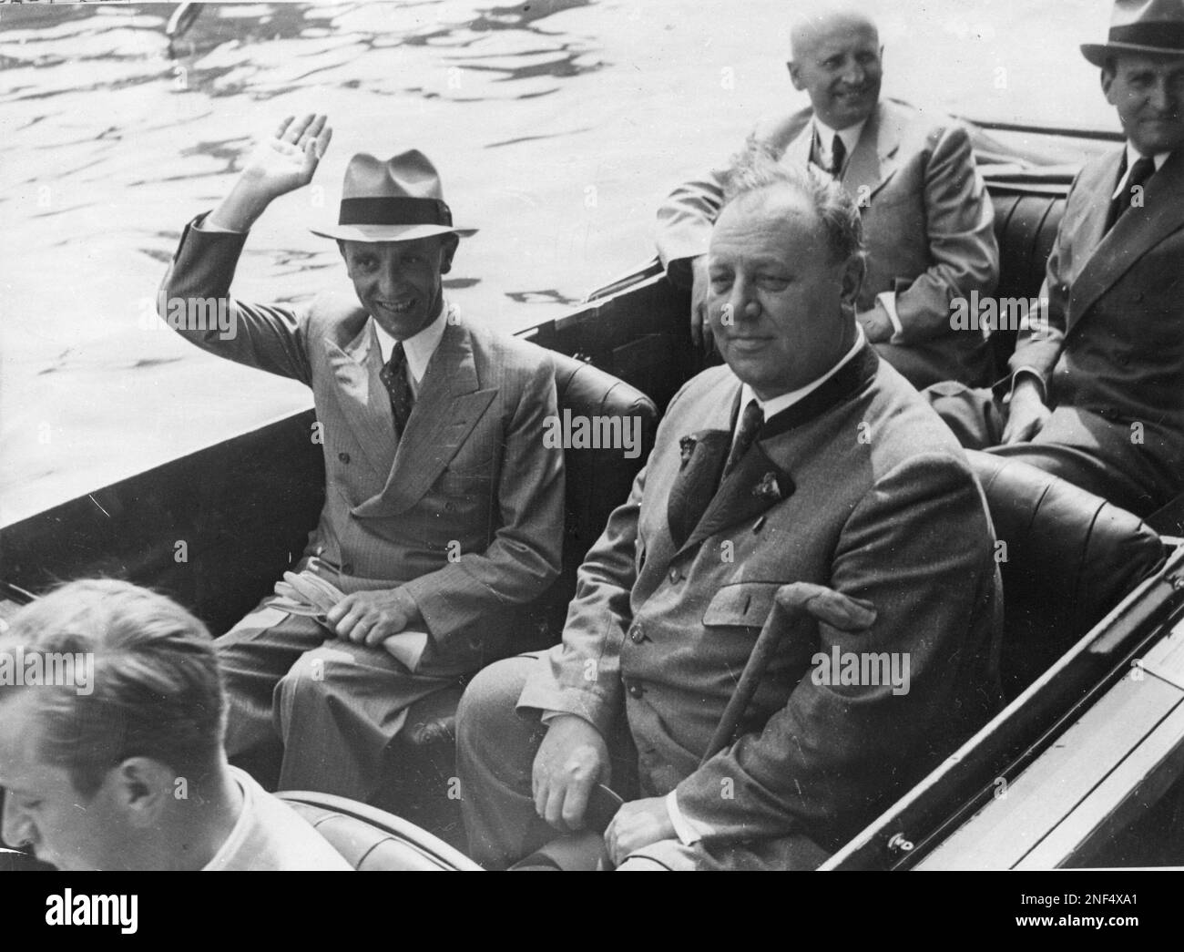 Undated image of Joseph Goebbles, left, waving while sitting next to ...
